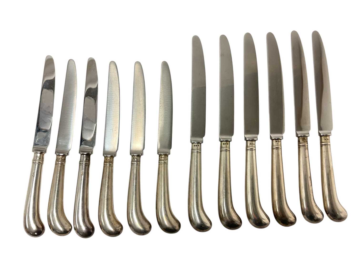 Lot 309 - Composite set of six table knives with