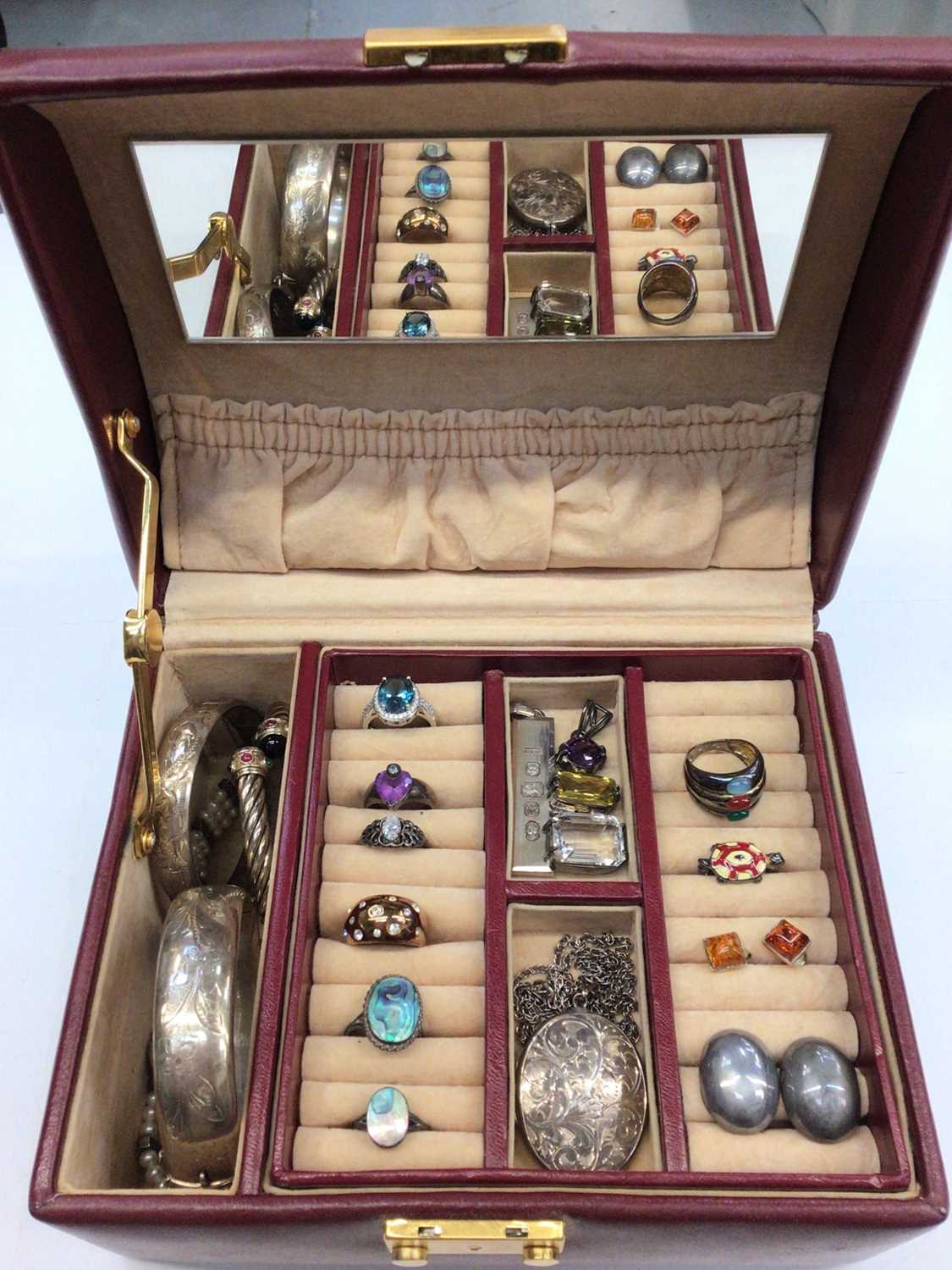 Lot 258 - Red leather jewellery box containing silver