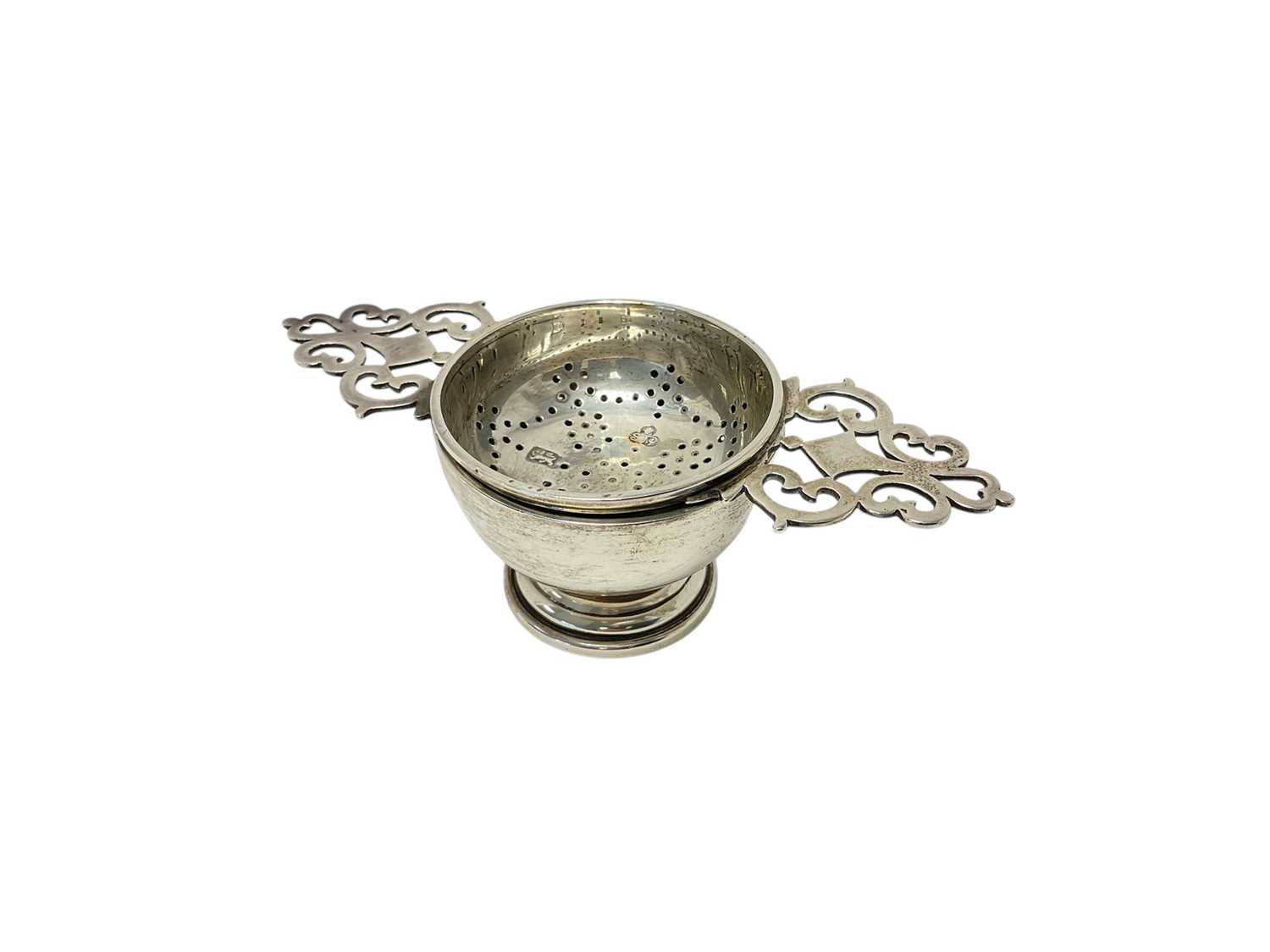 Lot 266 - Silver strainer on stand