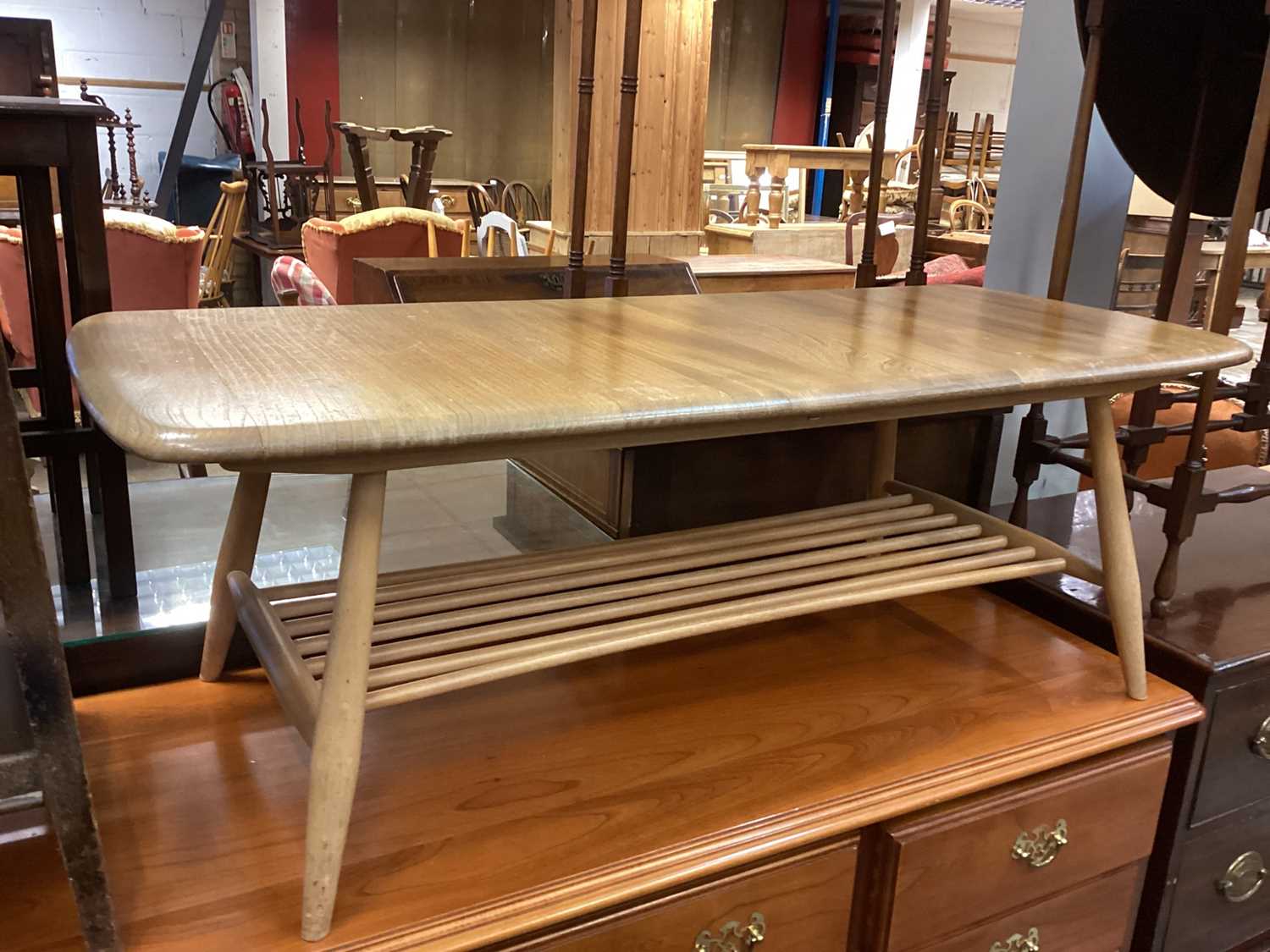 Lot 1265 - Ercol coffee table with magazine rack