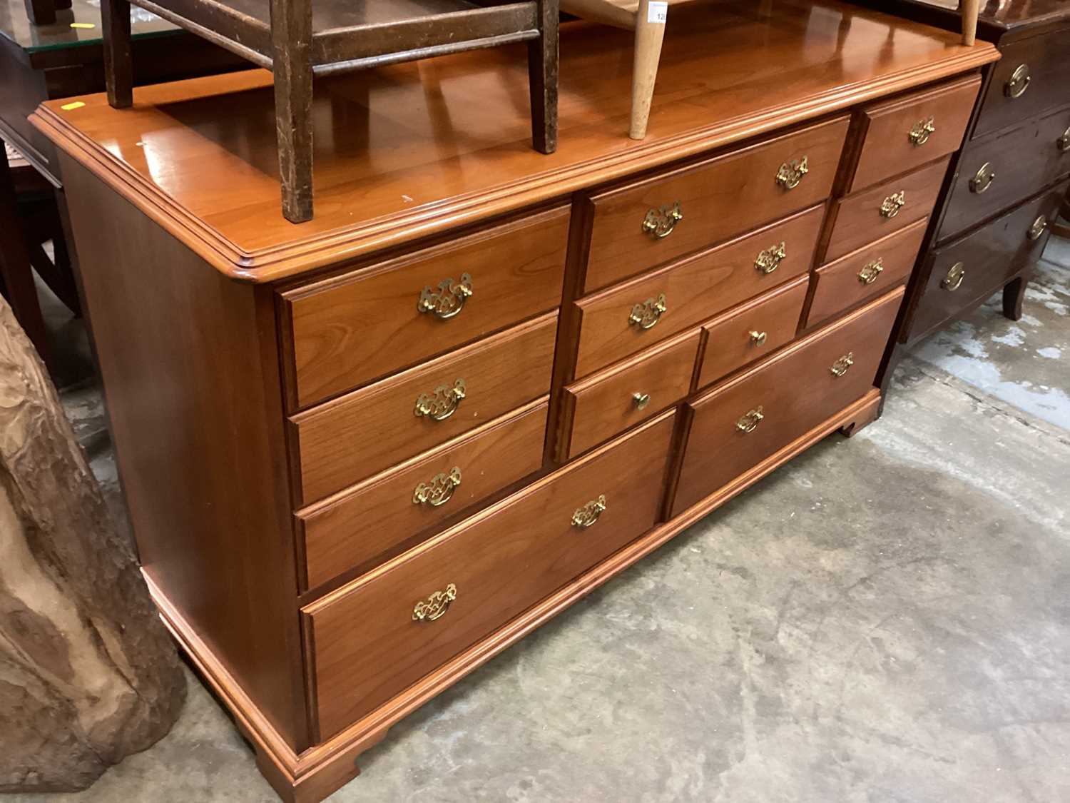 Lot 1267 - Modern cherrywood chest with arrangement of