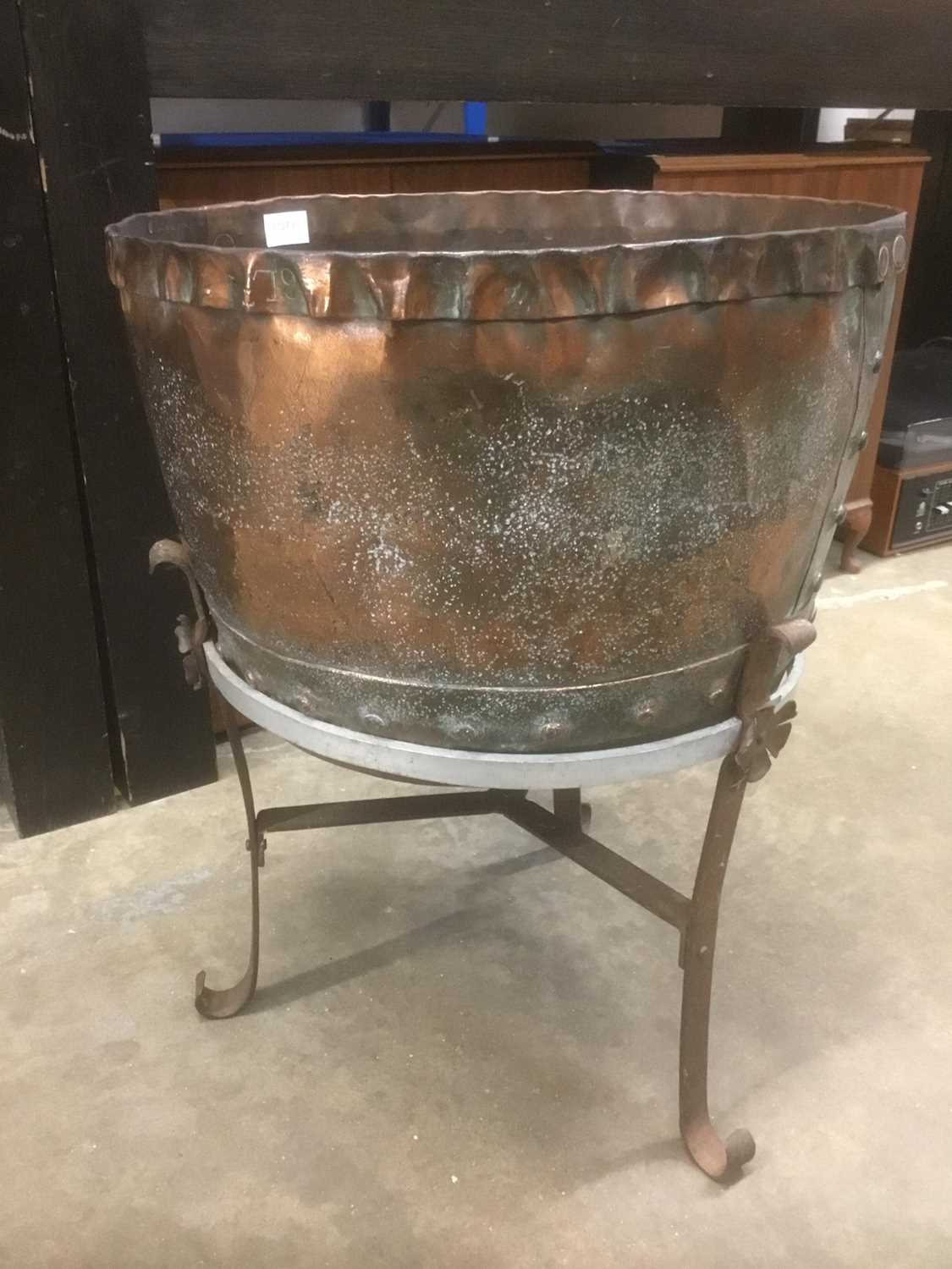 Lot 171 - Antique riveted copper vessel, raised on