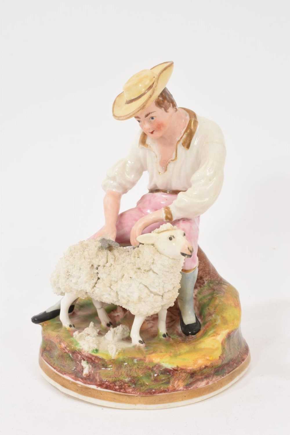 Lot 206 - Dudson type figure of a shepherd sheering a