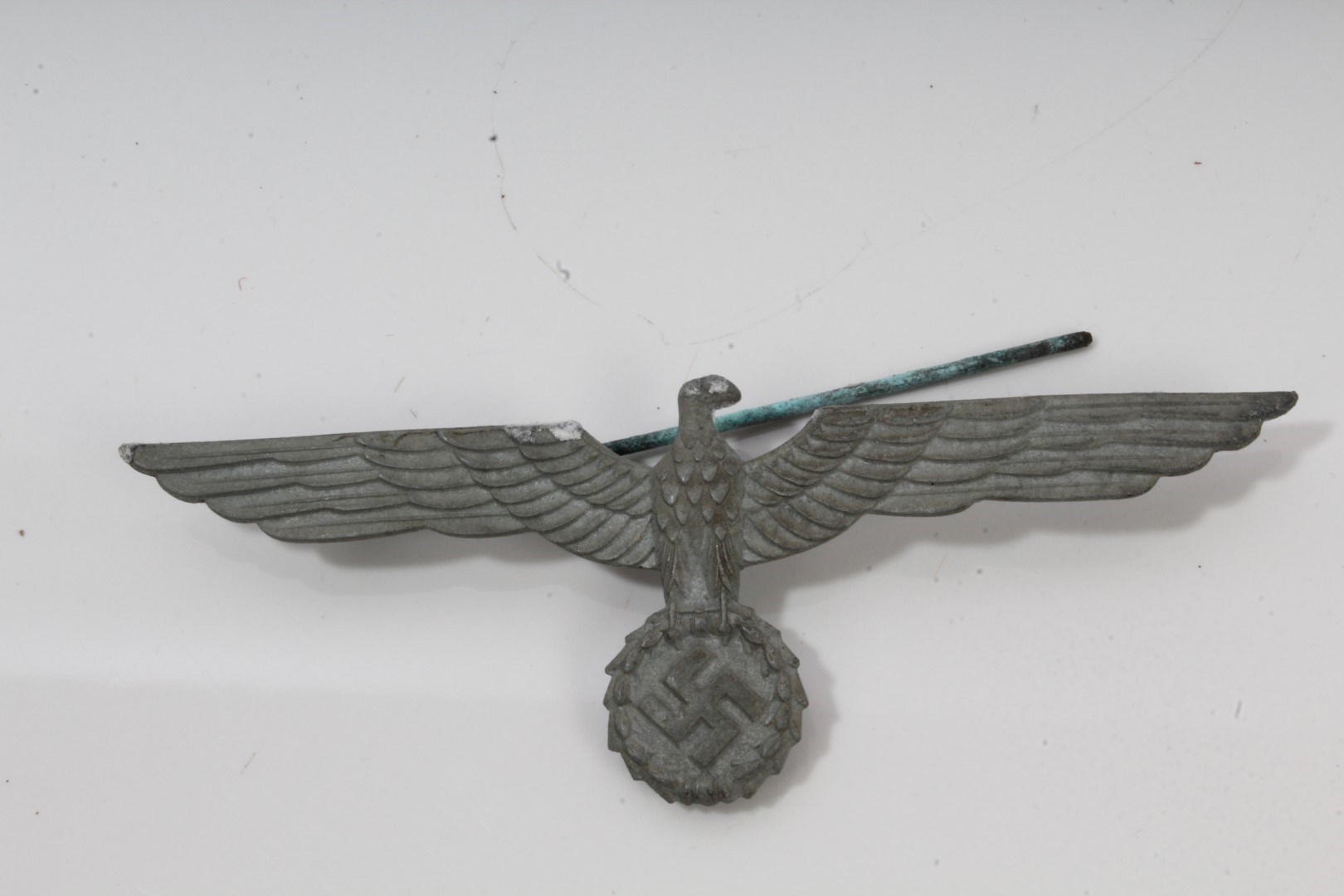Lot 758 - Nazi eagle and swastika cap badge with pin