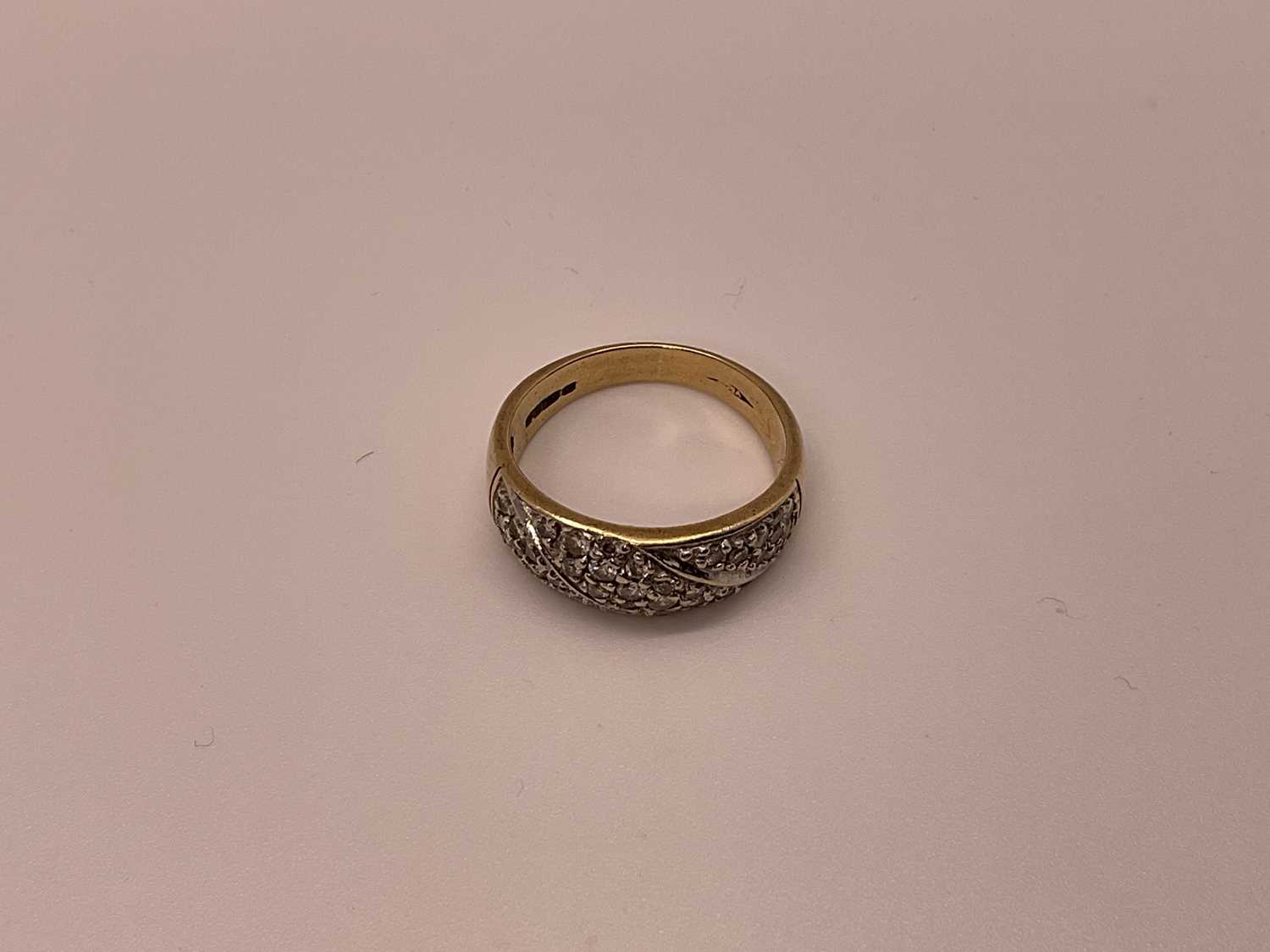 Lot 30 - 9ct gold ring with a band of pavé set