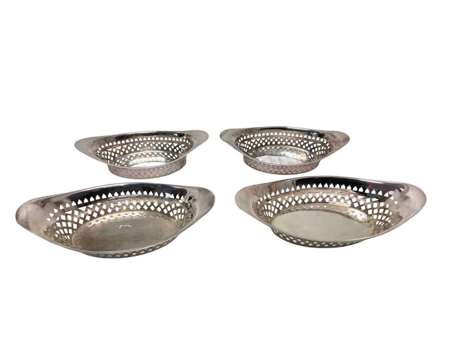 Lot 415 - Set of four silver navette form bon-bon