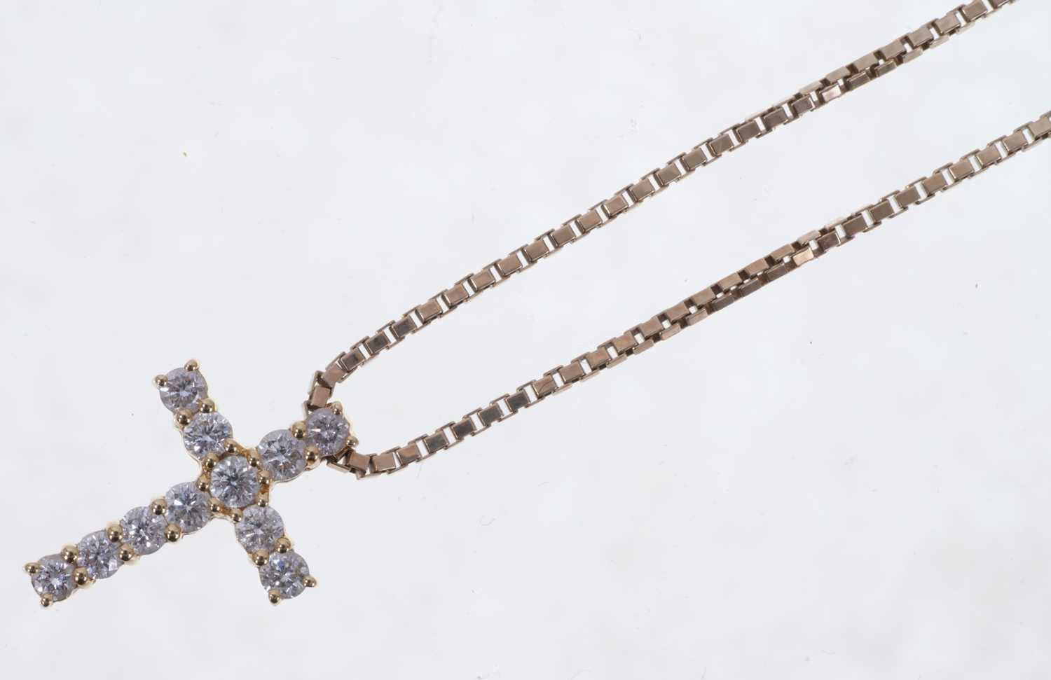 Lot 605 - Diamond cross pendant with eleven brilliant