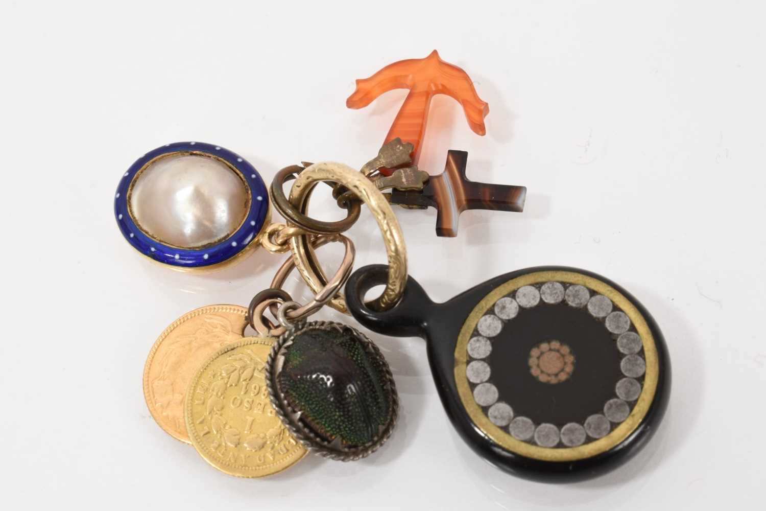 Lot 523 - Group of antique fobs on a gold split ring