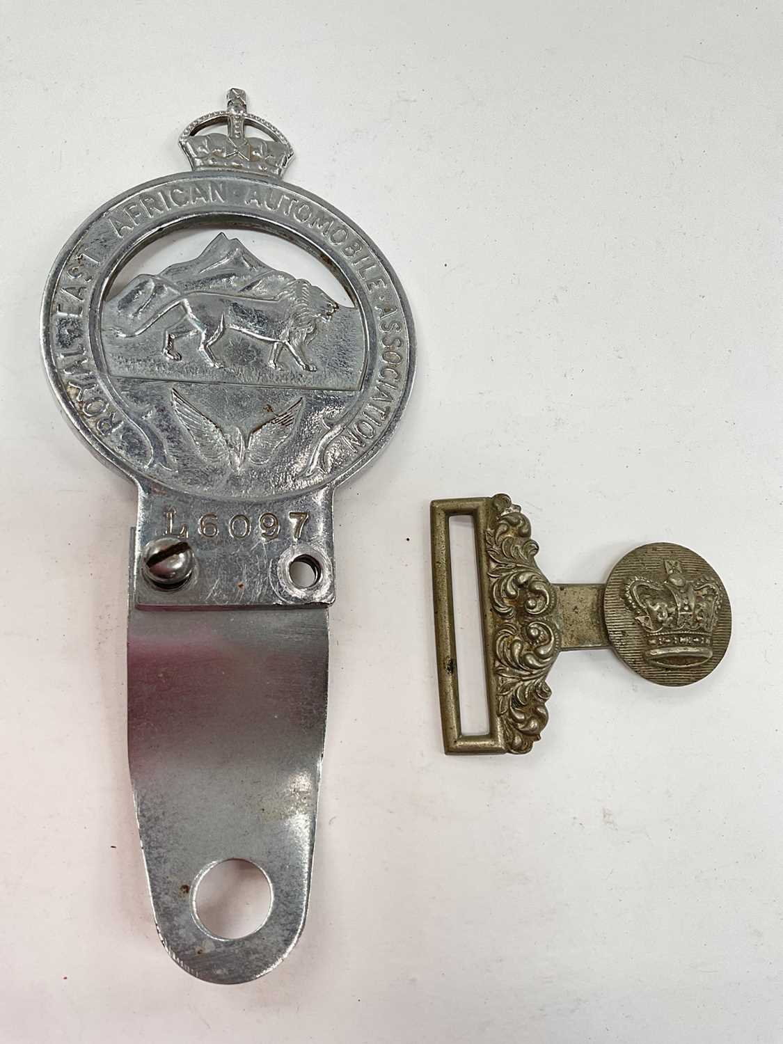 Lot 372 - East African RAC badge and military buckle