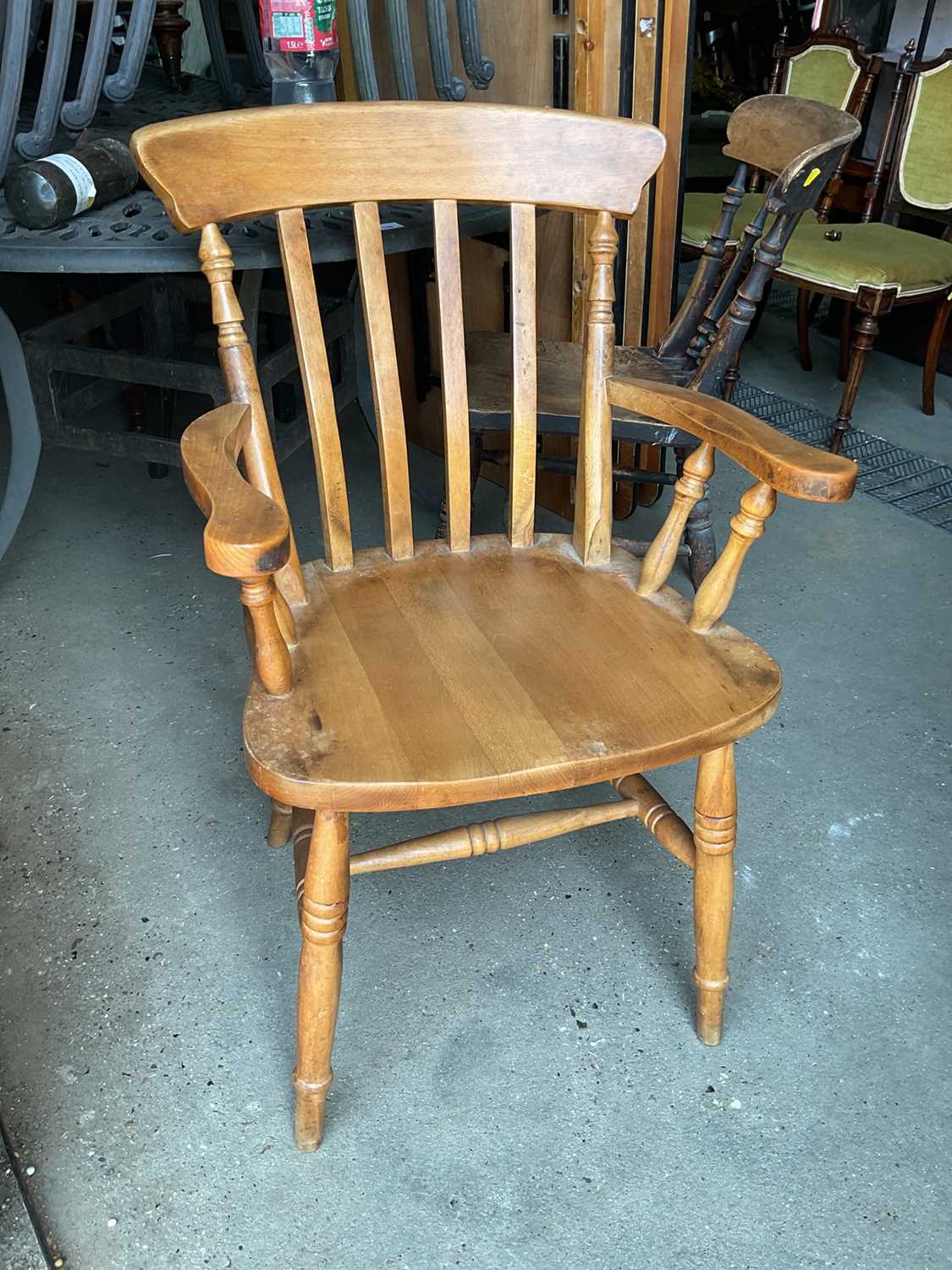 Lot 217 - Pine kitchen elbow chair