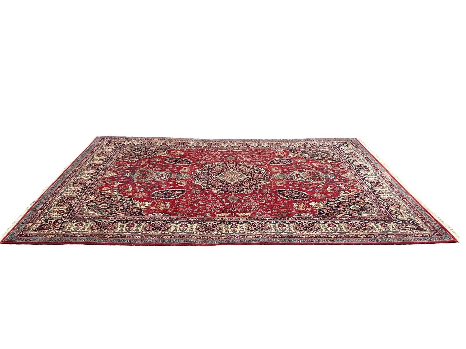 Lot 1334 - Large eastern carpet decorated with animals