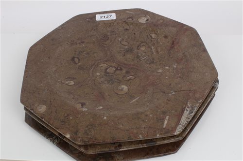 Lot 2127 - Four octagonal plates with fossil