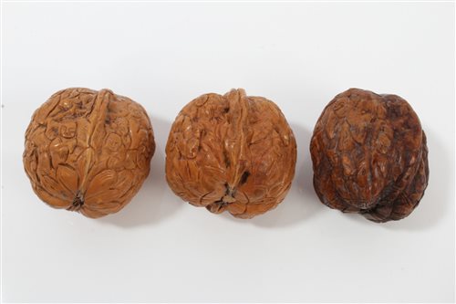 Lot 918 - Three Japanese carved walnut shells, each