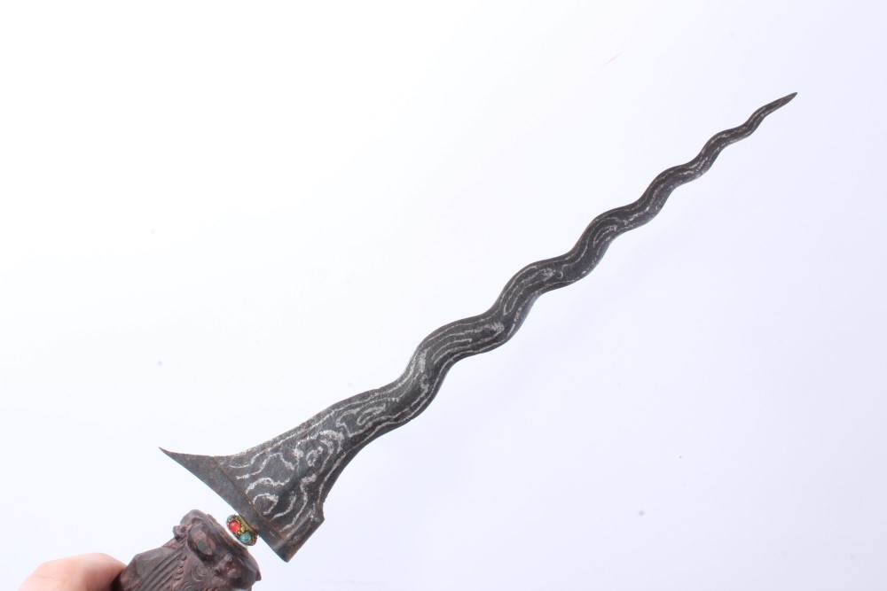 Lot 833 - Two Malayan Kris Daggers in ornately carved