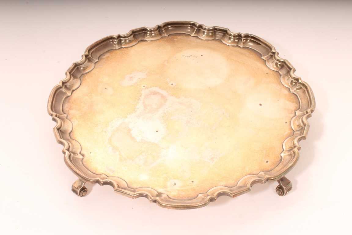 Lot 401 - Silver salver with shaped border on four