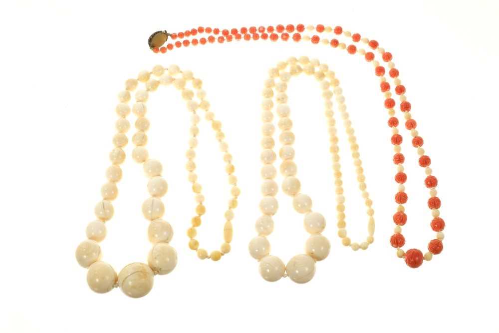 Lot 428 - Two ivory necklaces pre 1947, one coral and
