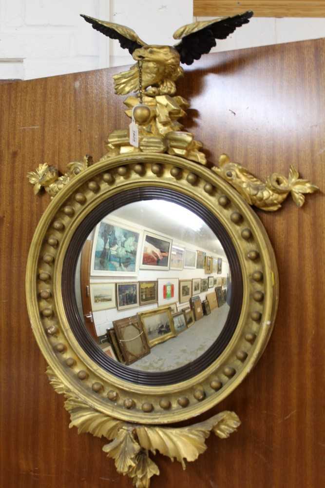 Lot 1625 - Regency gilt gesso convex wall mirror