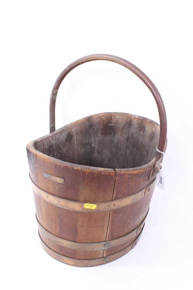 Lot 555 - Teak and brass bound coal bucket made from