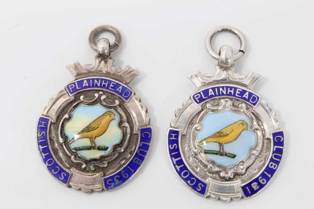 Lot 3724 - Two enamelled silver canary fancier’s