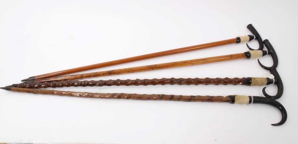 Lot 741 - Four Alpine walking sticks with Ibex horn