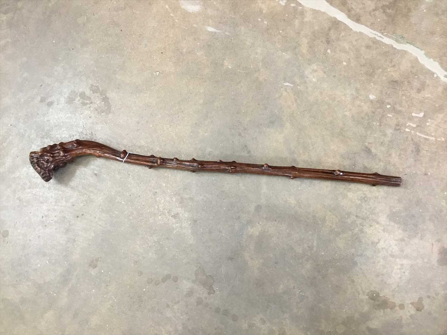 Lot 705 - Antique 'grotesque' wood walking stick, of