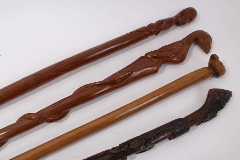 Lot 734 - 19th century carved hardwood tribal stick,