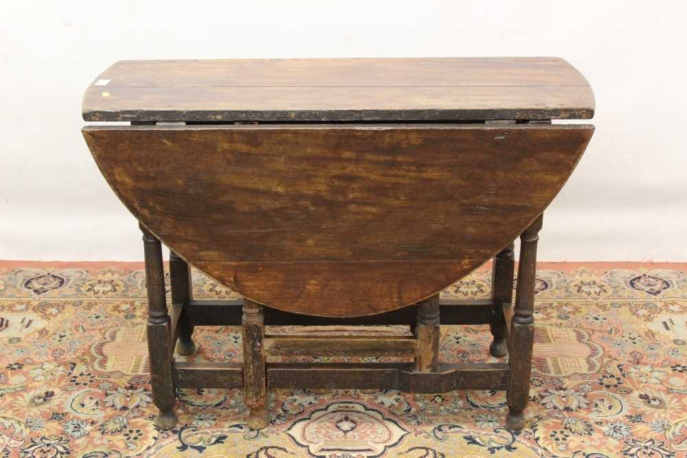 Lot 1264 - Early 18th century oak gate leg table