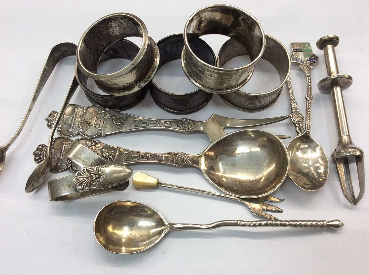 Lot 702 - Five various silver napkin rings, silver and