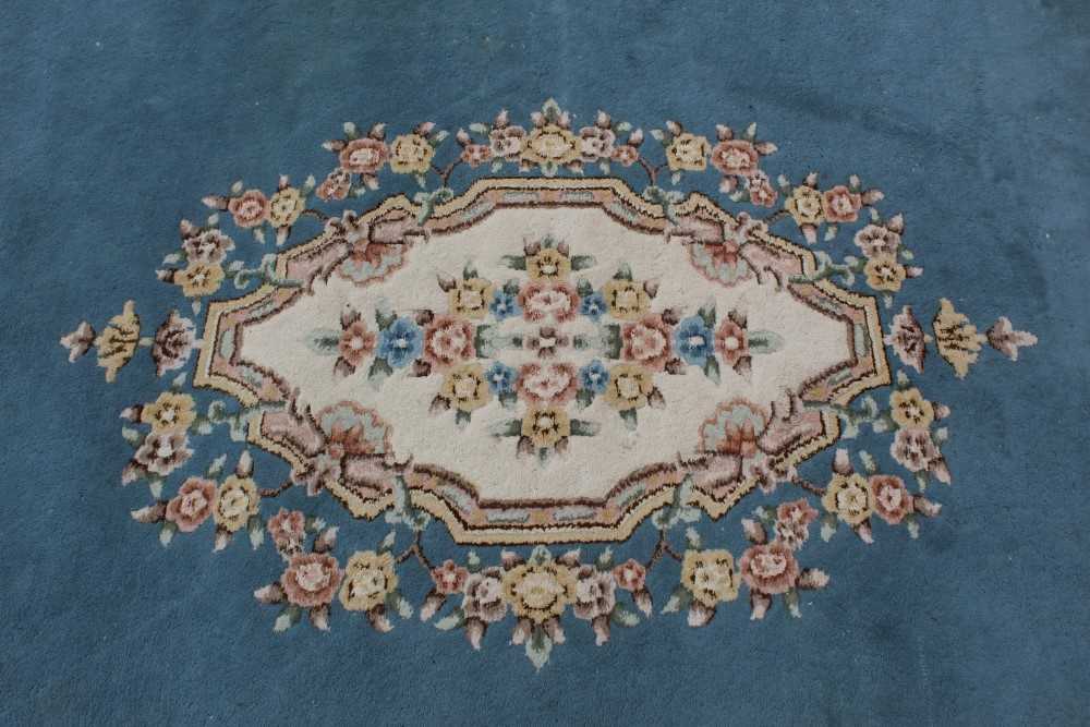 Lot 1372 - Aubusson style rug, with central oval