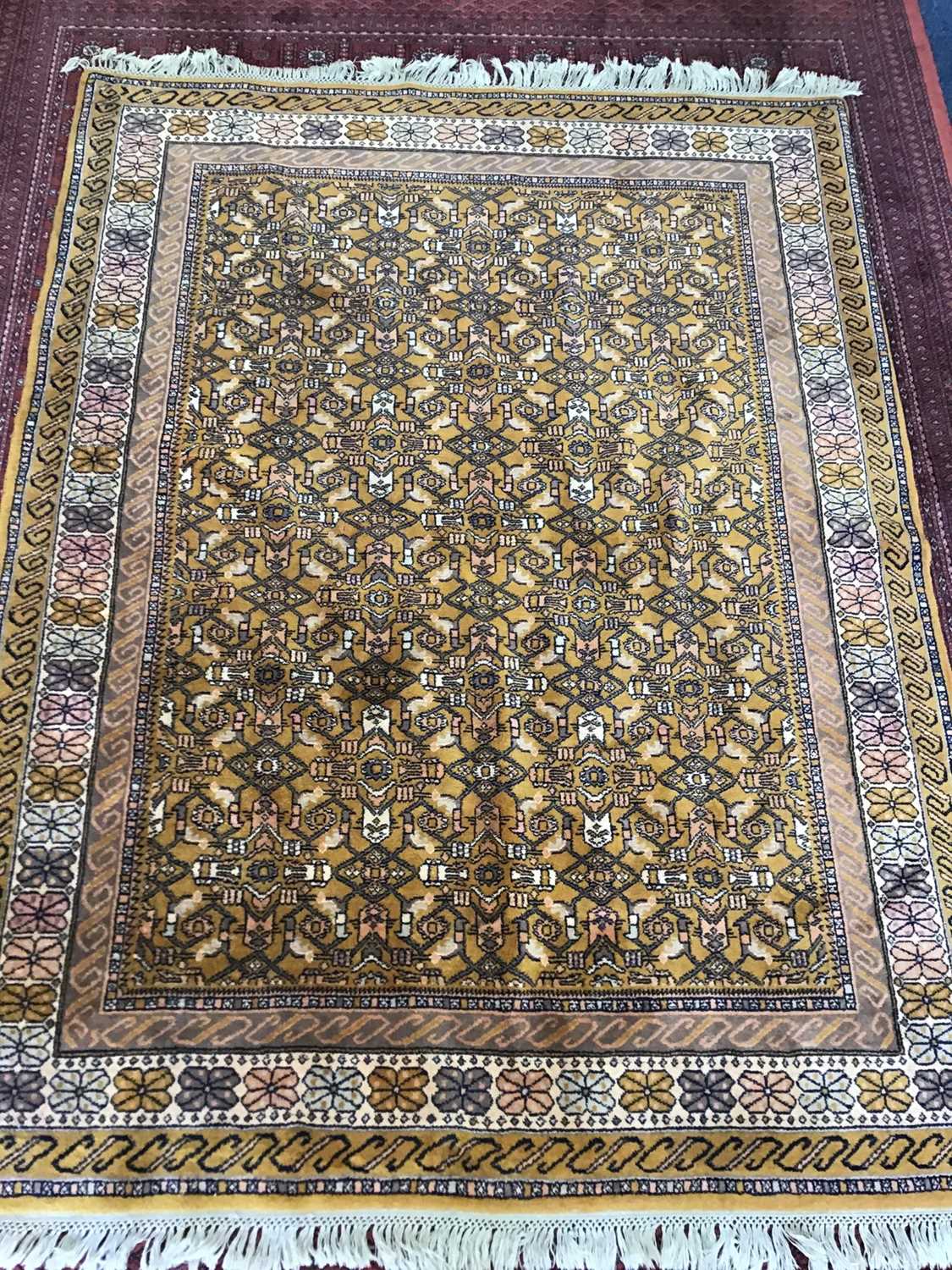 Lot 1080 - Afghan Bokhara gold ground rug, 260cm x