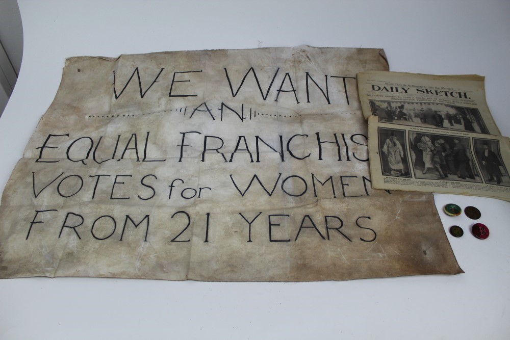Lot 1058 - Suffragette Banner c1920's plus two tin