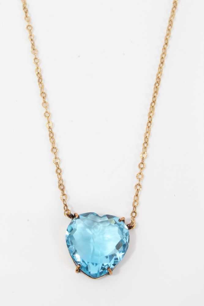 Lot 514 - Blue topaz pendant on gold chain