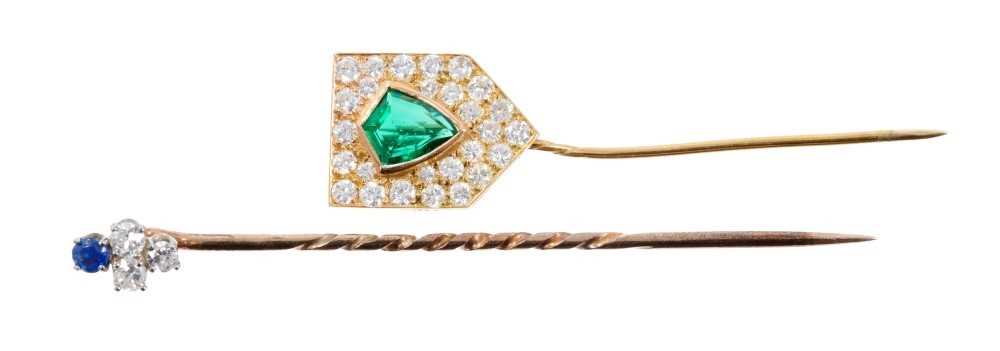 Lot 505 - Emerald and diamond stick pin and a sapphire