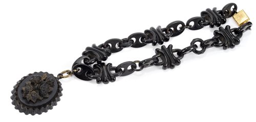 Lot 625 - Victorian jet pendant and necklace, the oval