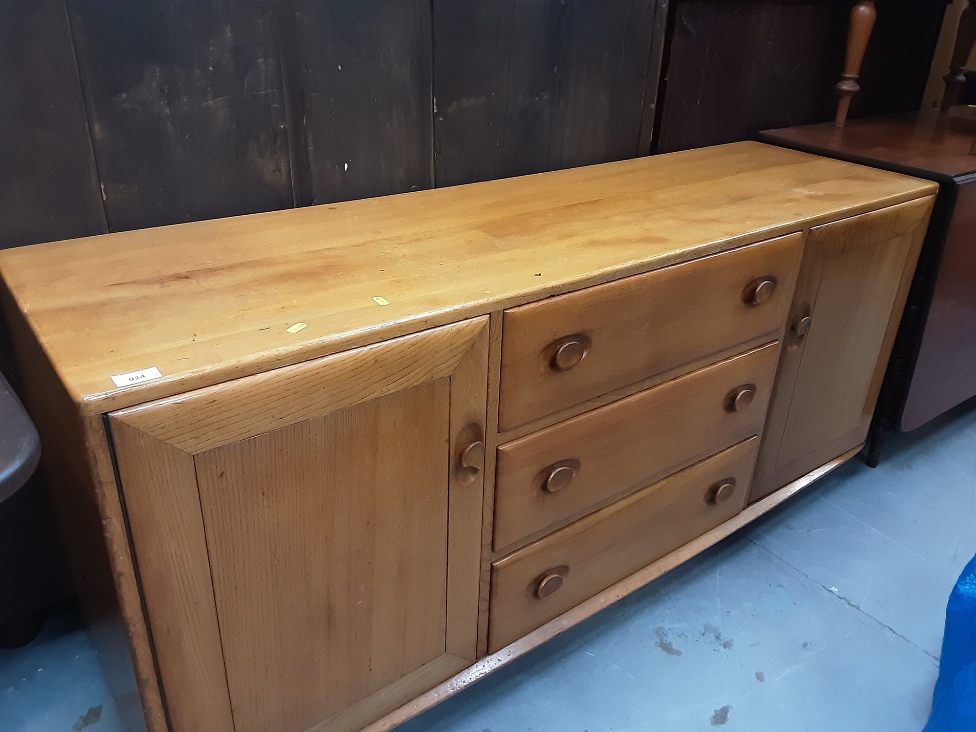 Lot 924 - Ercol sideboard with two cupboards and three