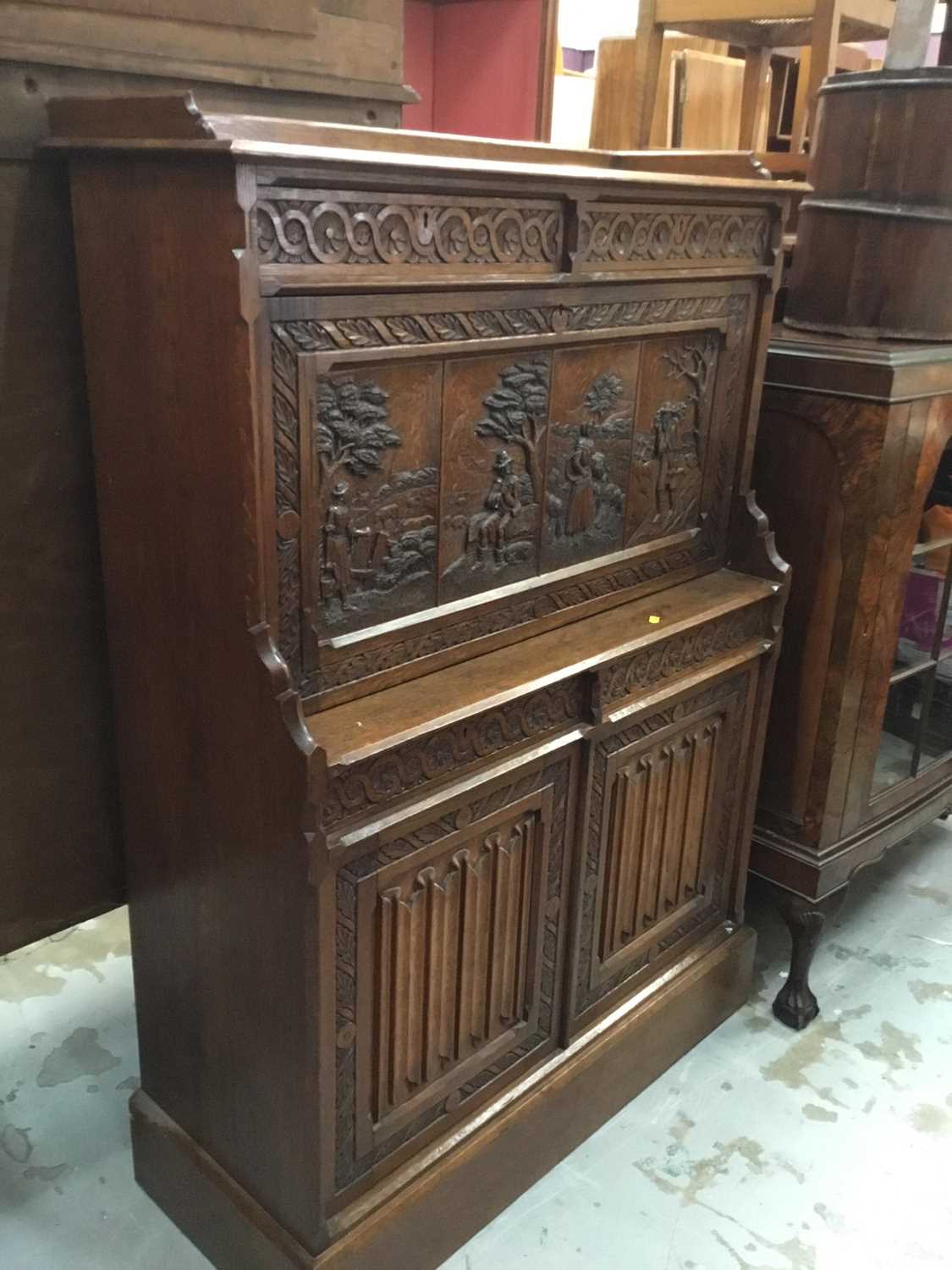 Lot 1001 - Edwardian carved oak escritoire with fall
