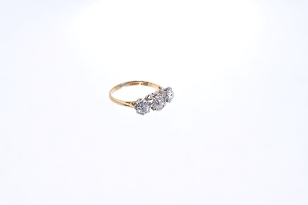Lot 558 - Diamond three stone ring in collet setting