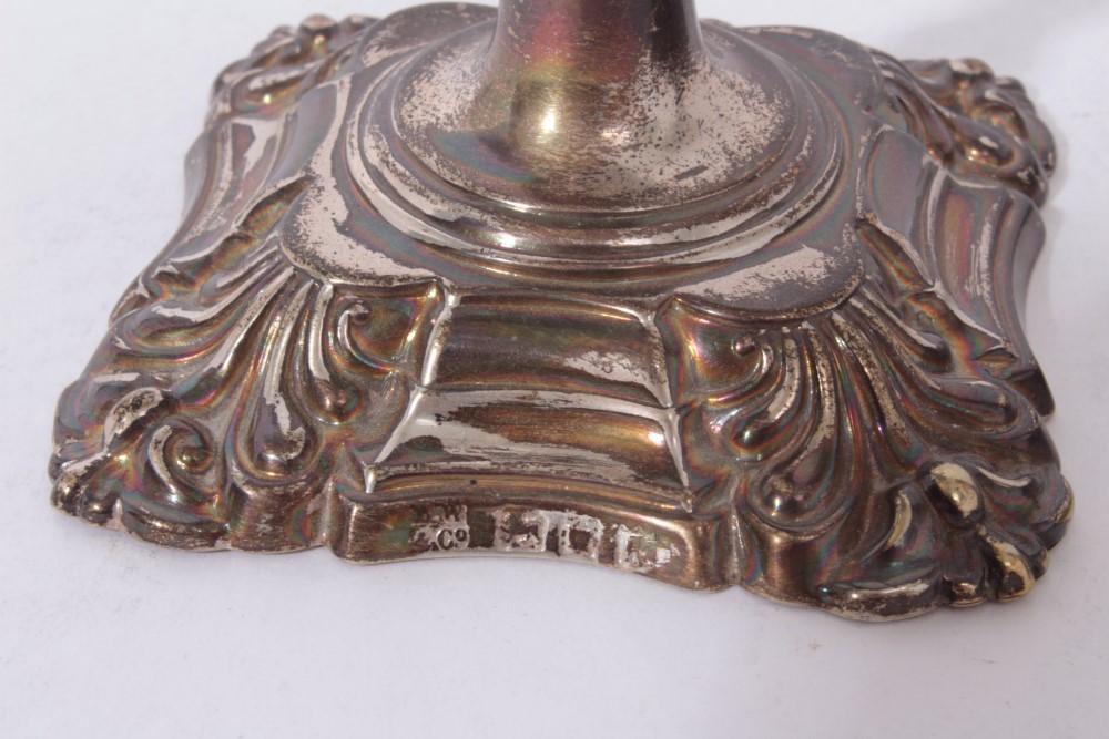 Lot 282 - Pair of Victorian silver taper sticks, with