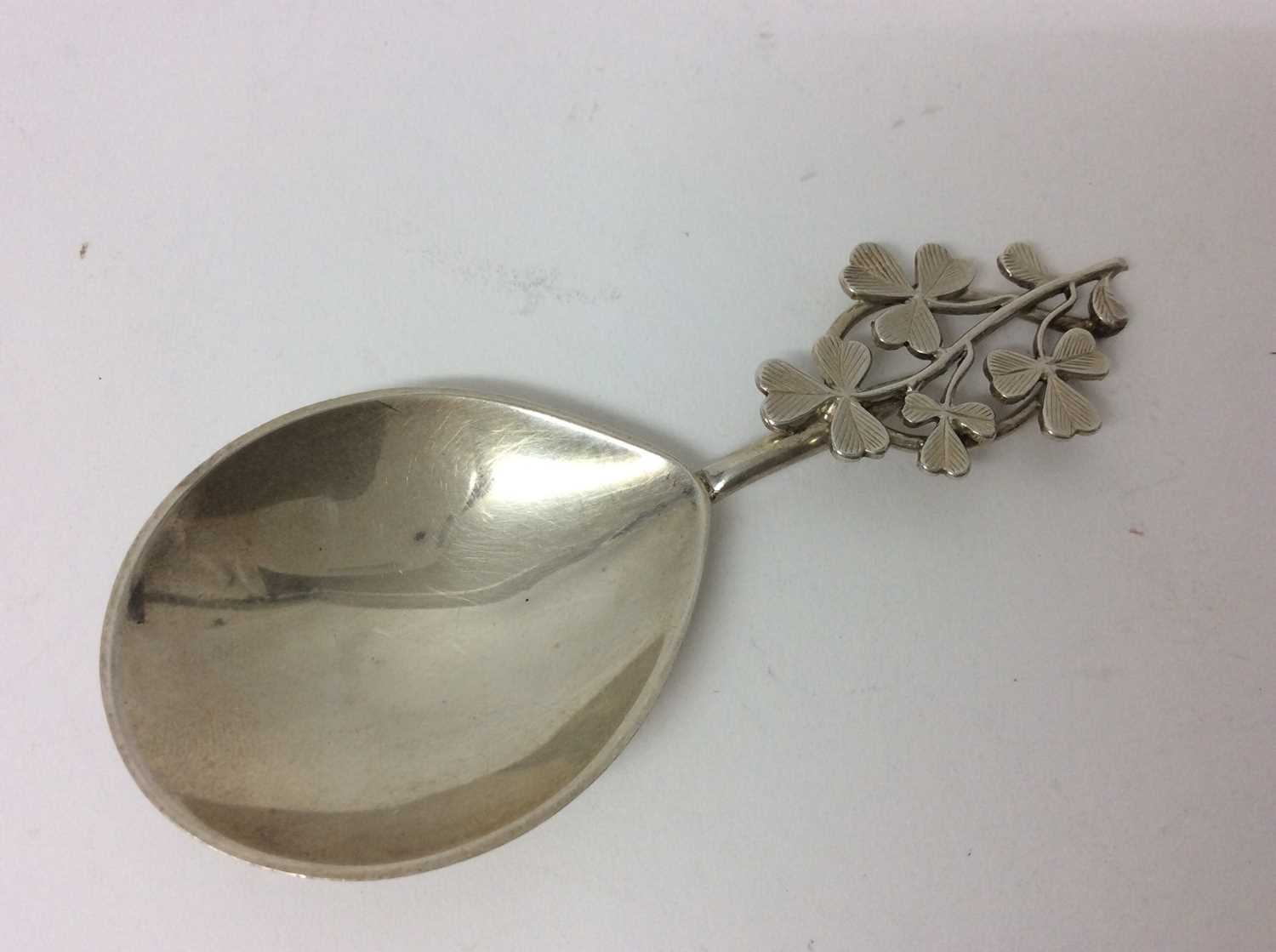 Lot 214 - Silver caddy spoon with clover leaf formed