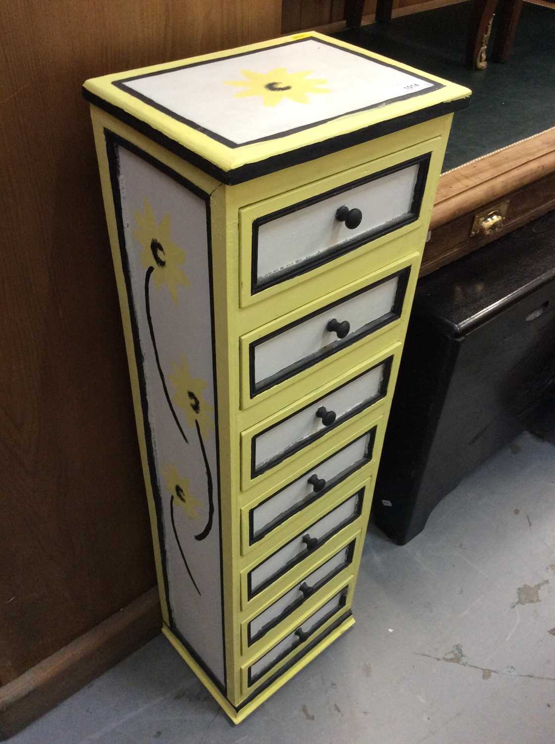 Lot 1014 - A small Arts and Crafts chest of seven