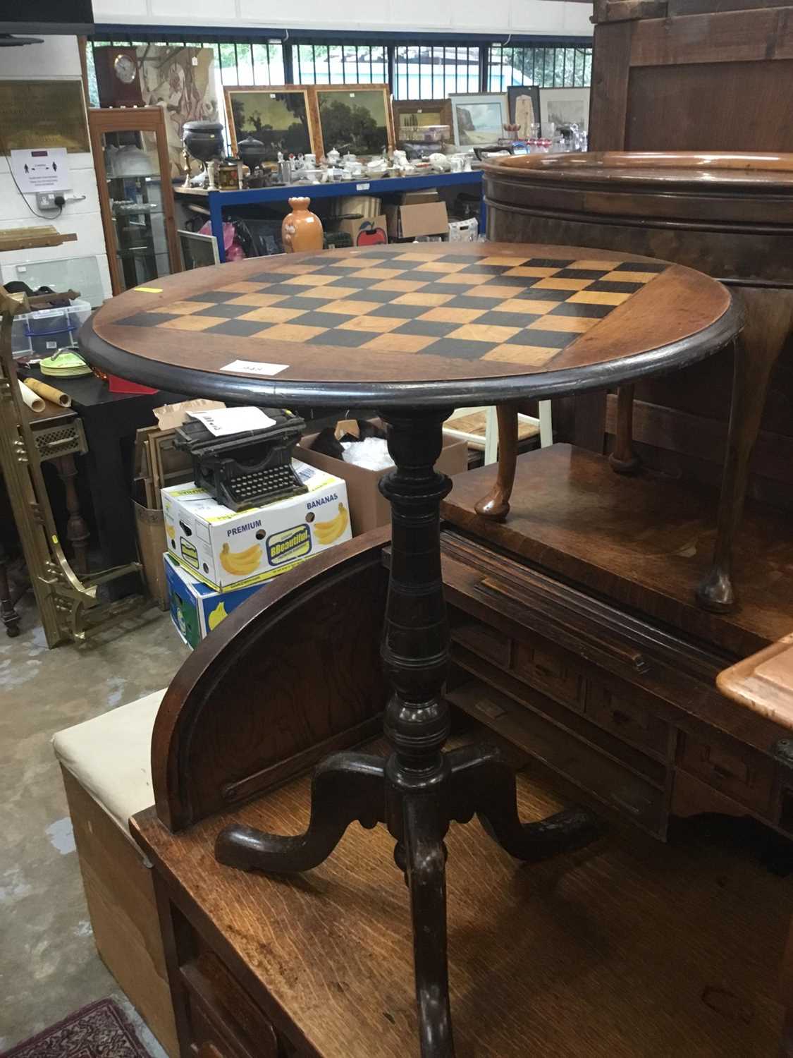 Lot 948 - Victorian walnut tripod games table with