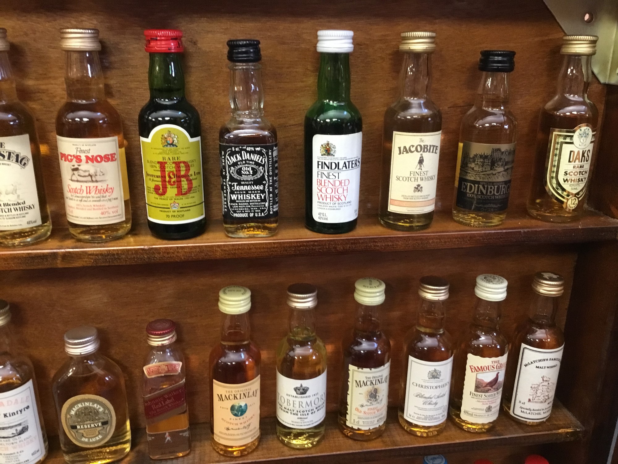 Lot 135 - Collection of miniature spirits in wall
