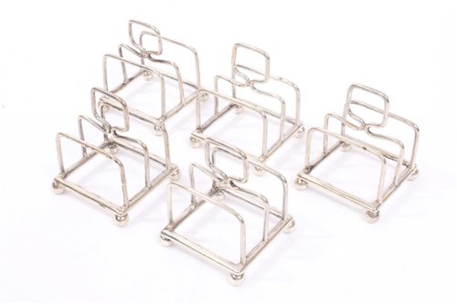 Lot 527 - Five 1920s silver individual toast racks of