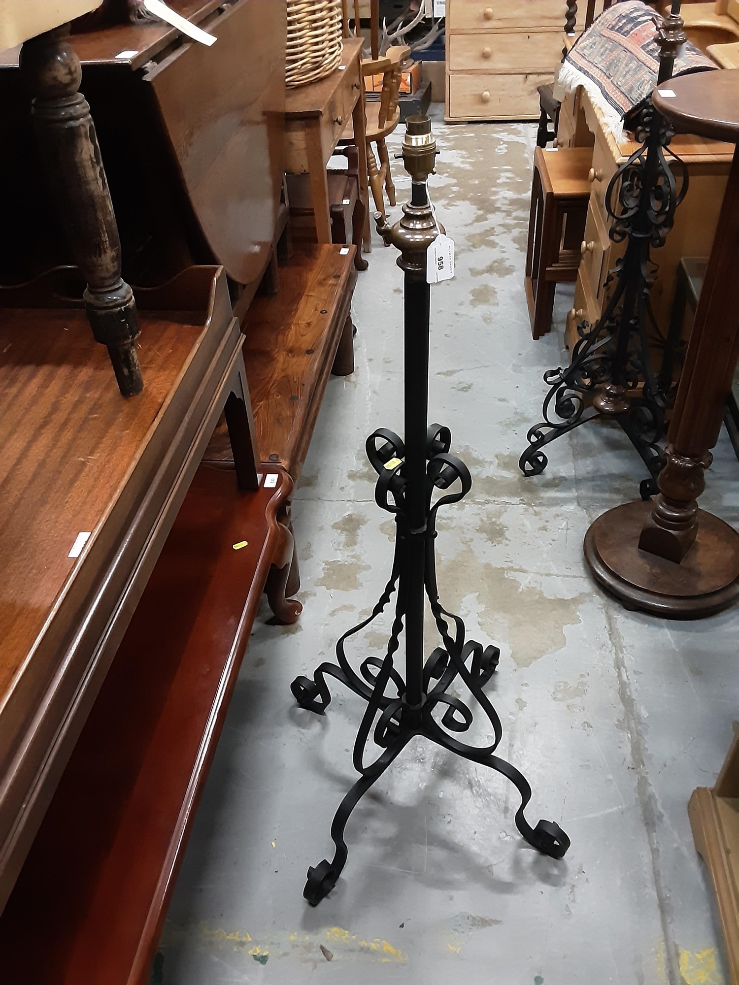 Lot 108 - Two early 20th century wrought iron oil lamp
