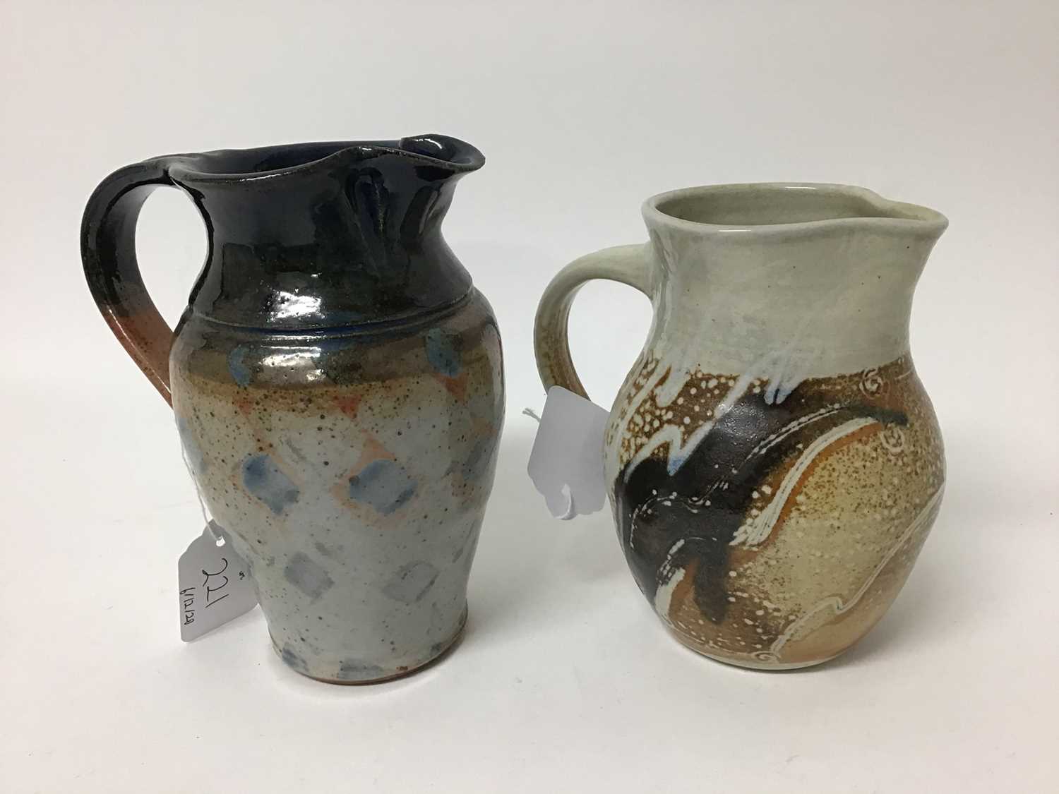 Lot 221 - Four salt glazed studio pottery jugs by John
