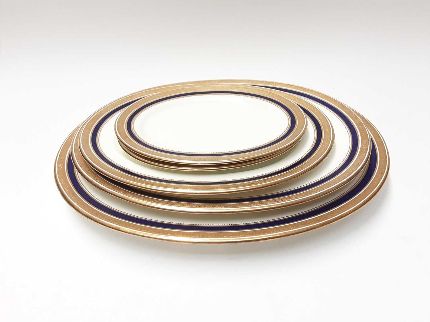 Lot 210 - Cauldon China dinner service with raised