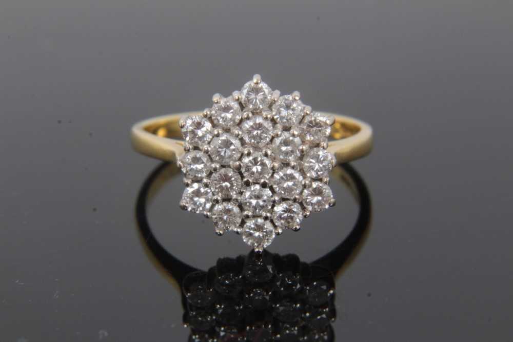 Lot 256 - Diamond cluster ring with a hexagonal
