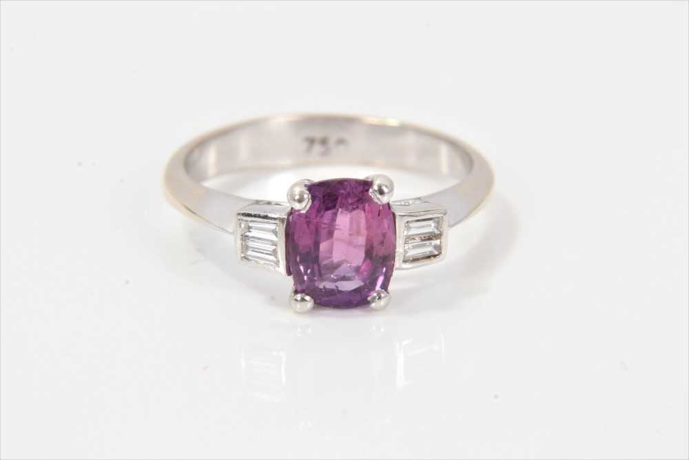 Lot 302 - Ruby and diamond ring with an oval mixed cut