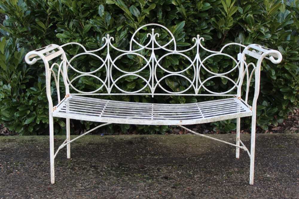 Lot 870 - White painted wrought metal garden bench
