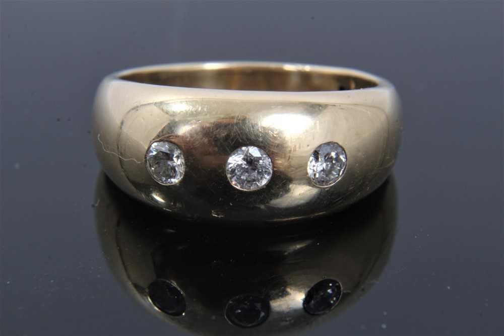 Lot 328 - Diamond three stone gypsy ring with three